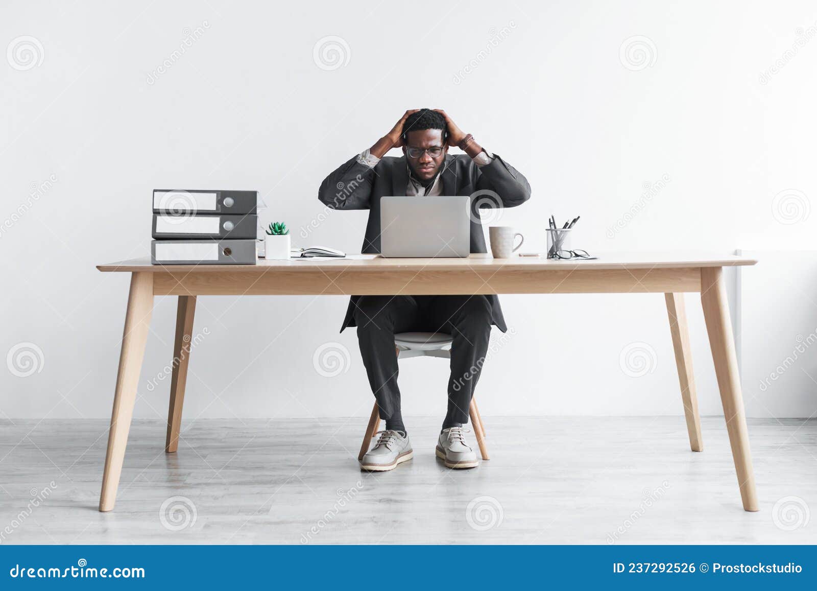 Stressed Man At Desk