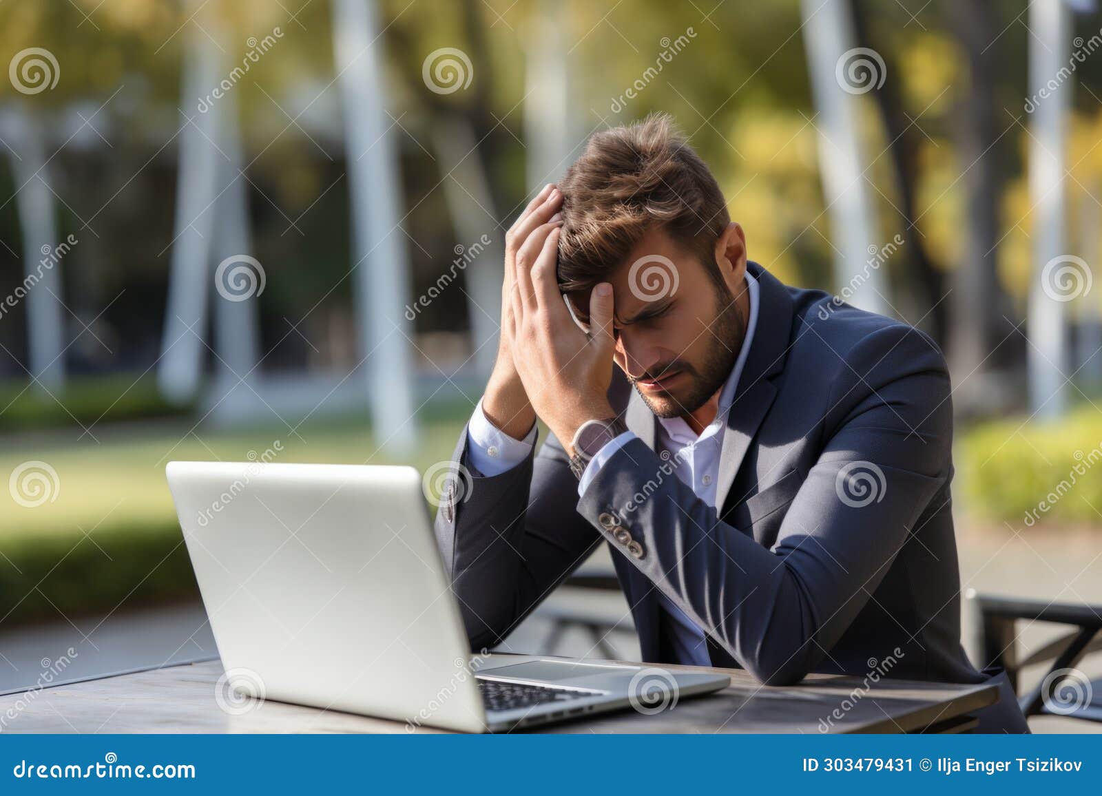 Stressed Young Businessman Working on Laptop, Feeling Overwhelmed with ...