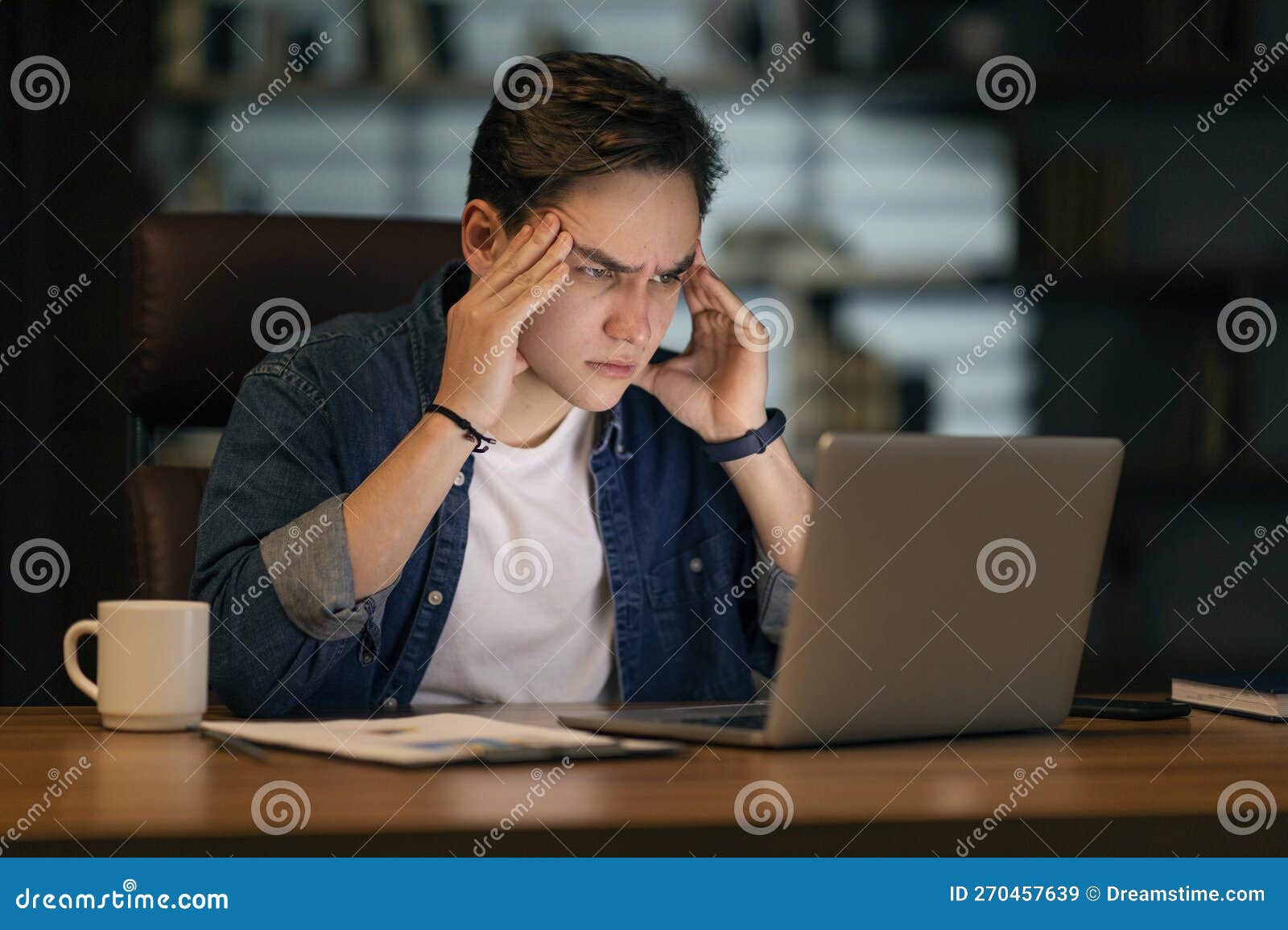 Stressed Young Man Looking at Laptop Screen, Touching Temples Stock ...