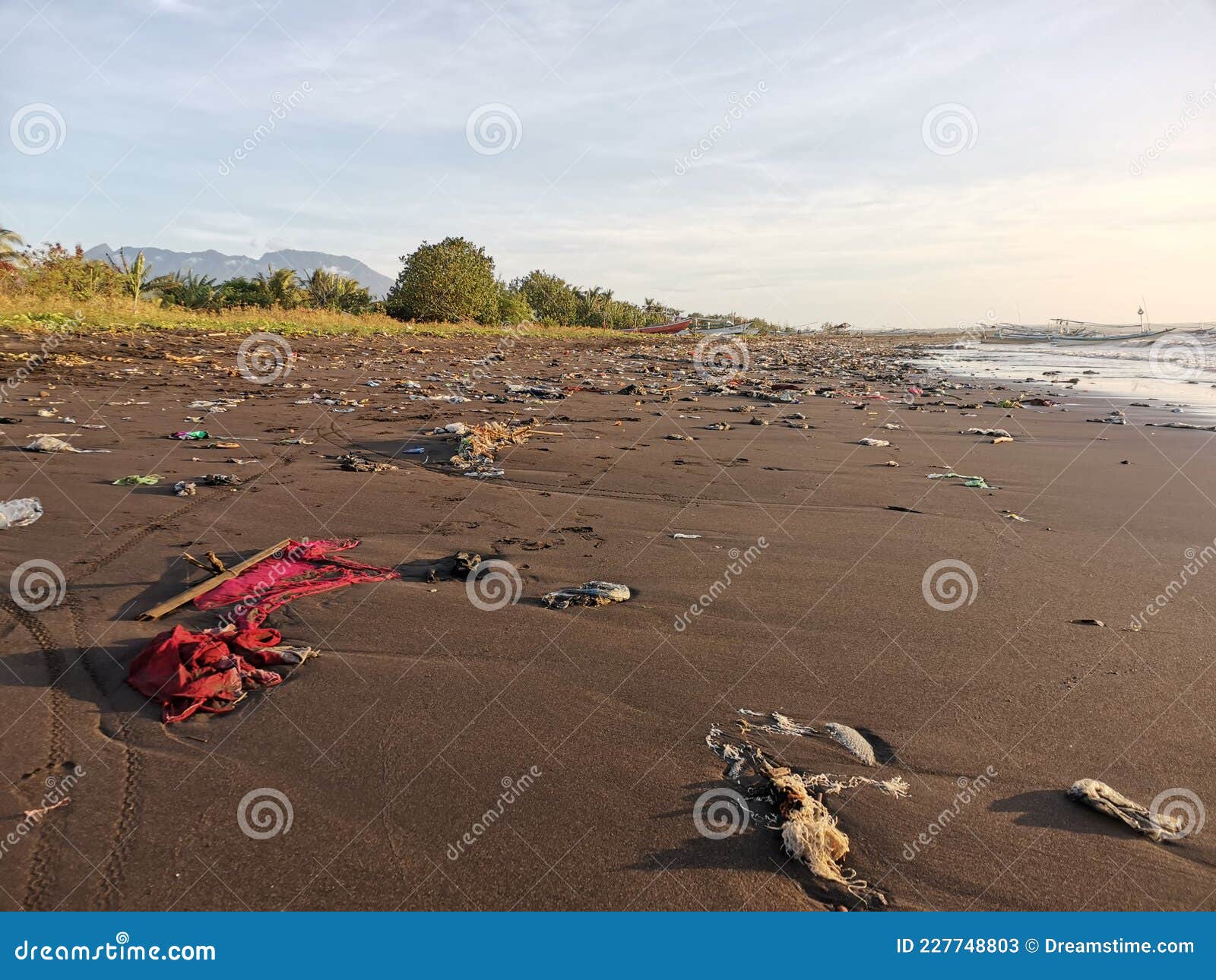 A Stretch of Beach Sand Polluted by Piles of Garbage Stock Image ...