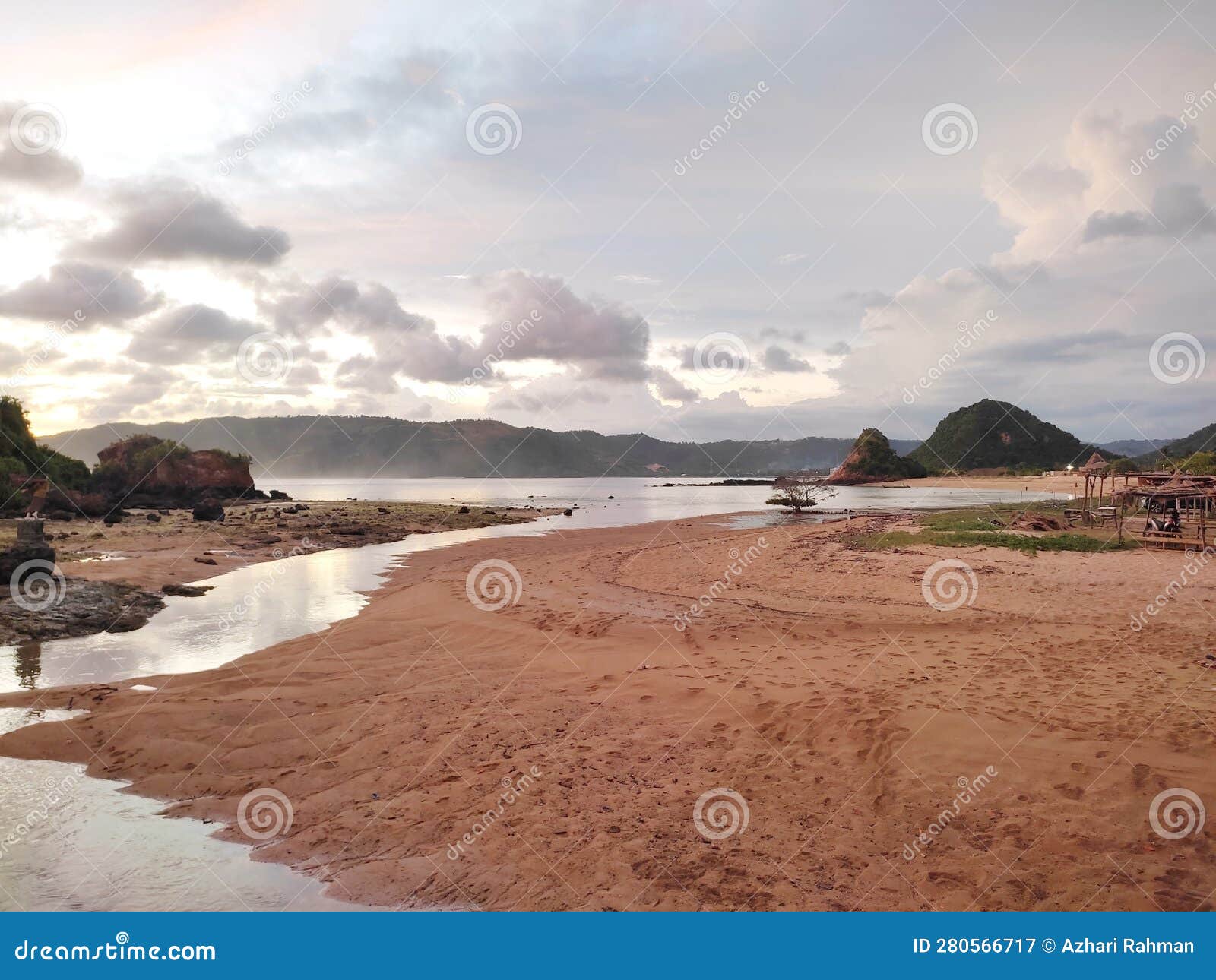 Stretch of Beach Sand with a River Flowing Towards the Sea and the ...