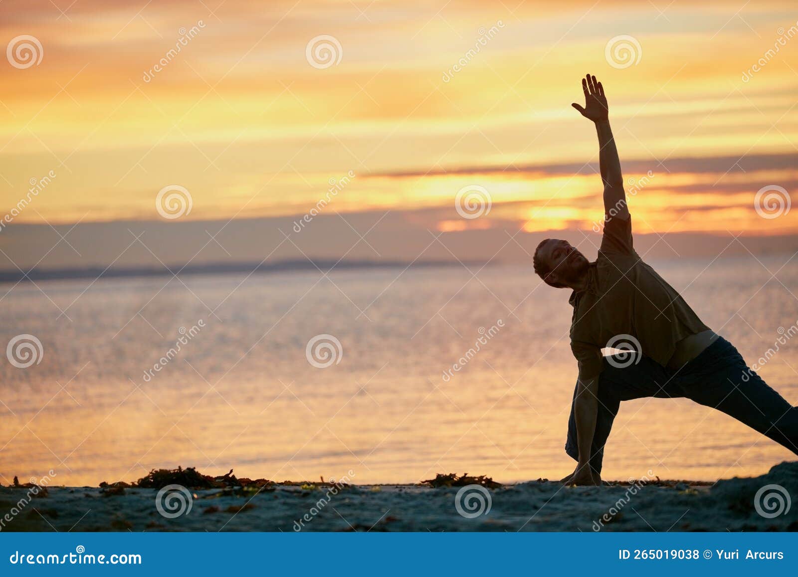 Stretch the Body, Stretch the Mind. a Man Practicing the Triangle Pose ...