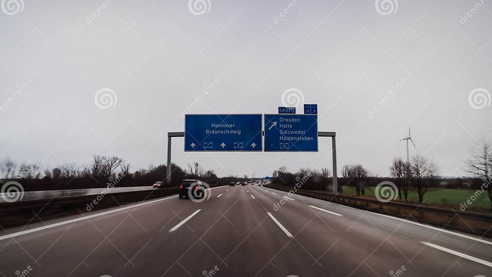 Stretch of an Empty Interstate Highway with Signs on Either Side of the ...