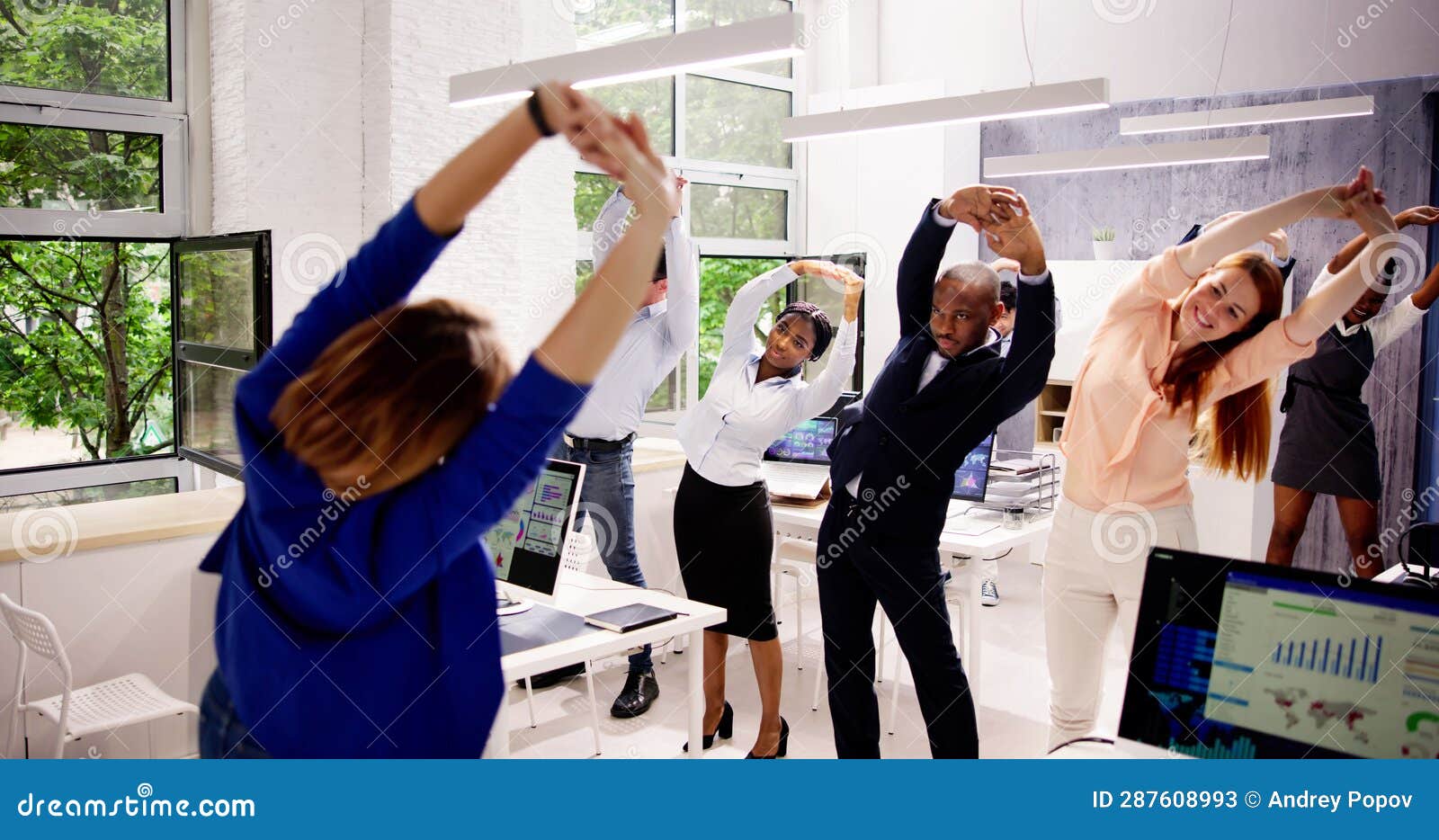 Stretch Exercise in Office stock image. Image of inclusive - 287608993