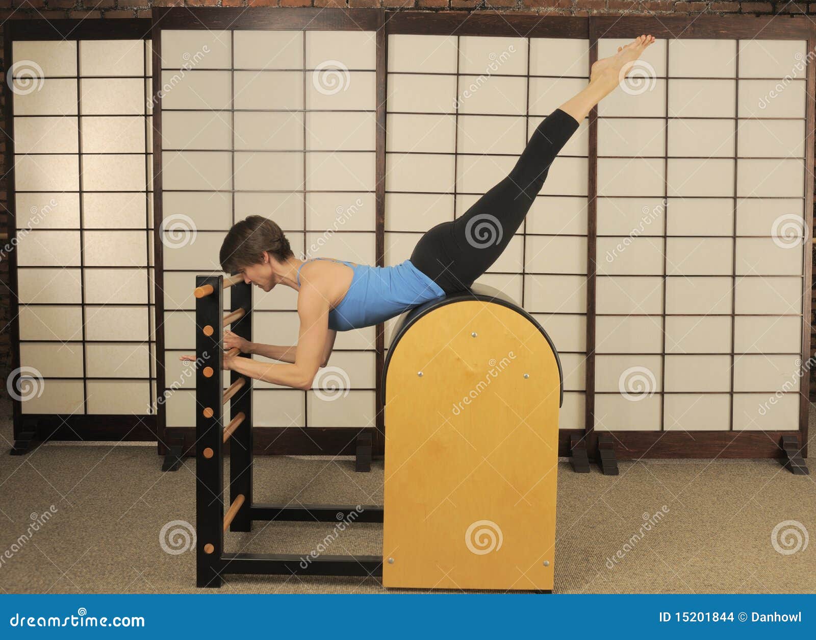 Stretch on Pilates Barrel stock photo. Image of muscular - 15201844