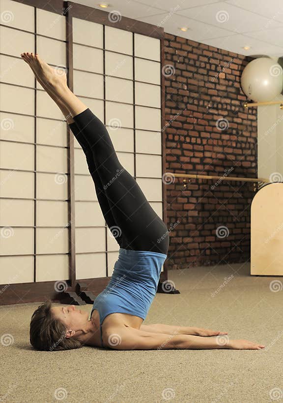 Stretch on Pilates Barrel stock photo. Image of slim - 15201868