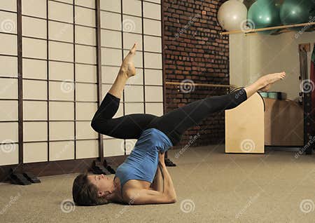 Stretch on Pilates Barrel stock image. Image of balance - 15201877