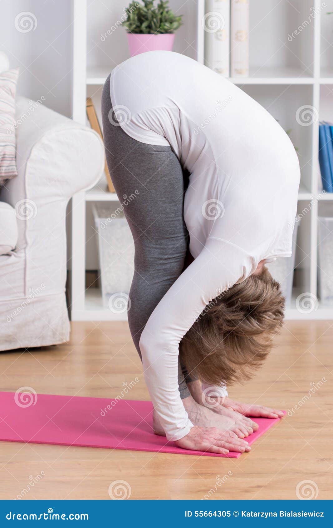 Stretched elderly woman stock image. Image of concentration - 55664305