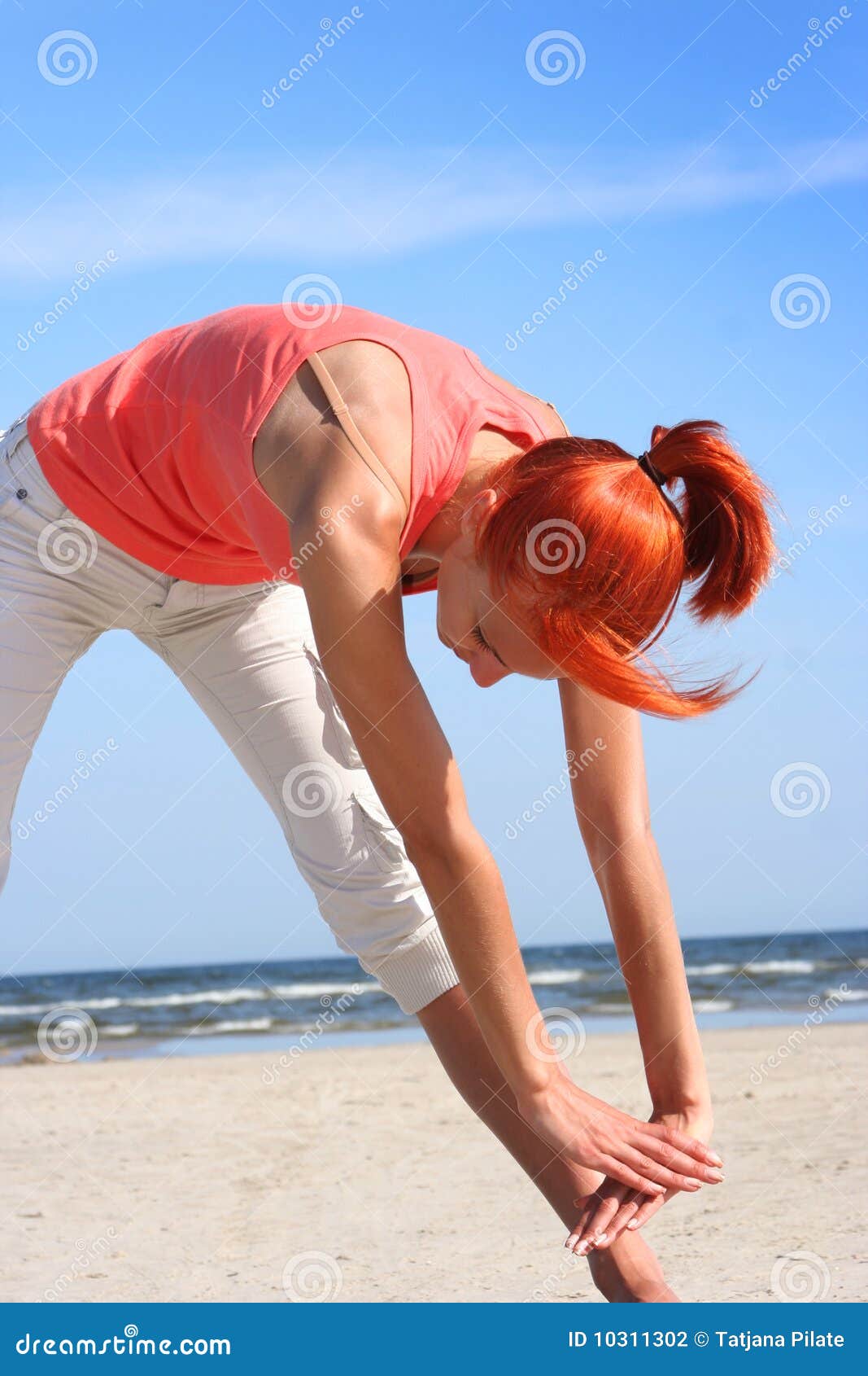 Stretching on beach stock photo. Image of exercising - 10311302
