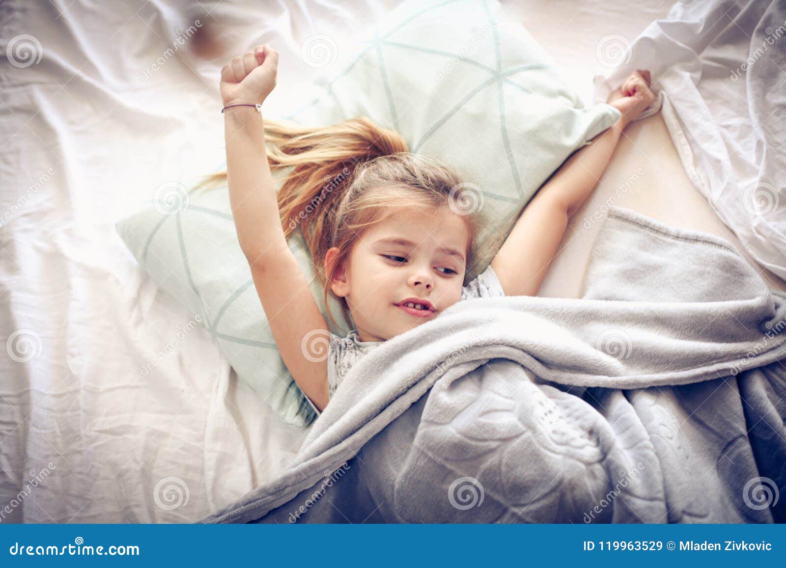 Stretching in bed. stock image. Image of home, child - 119963529