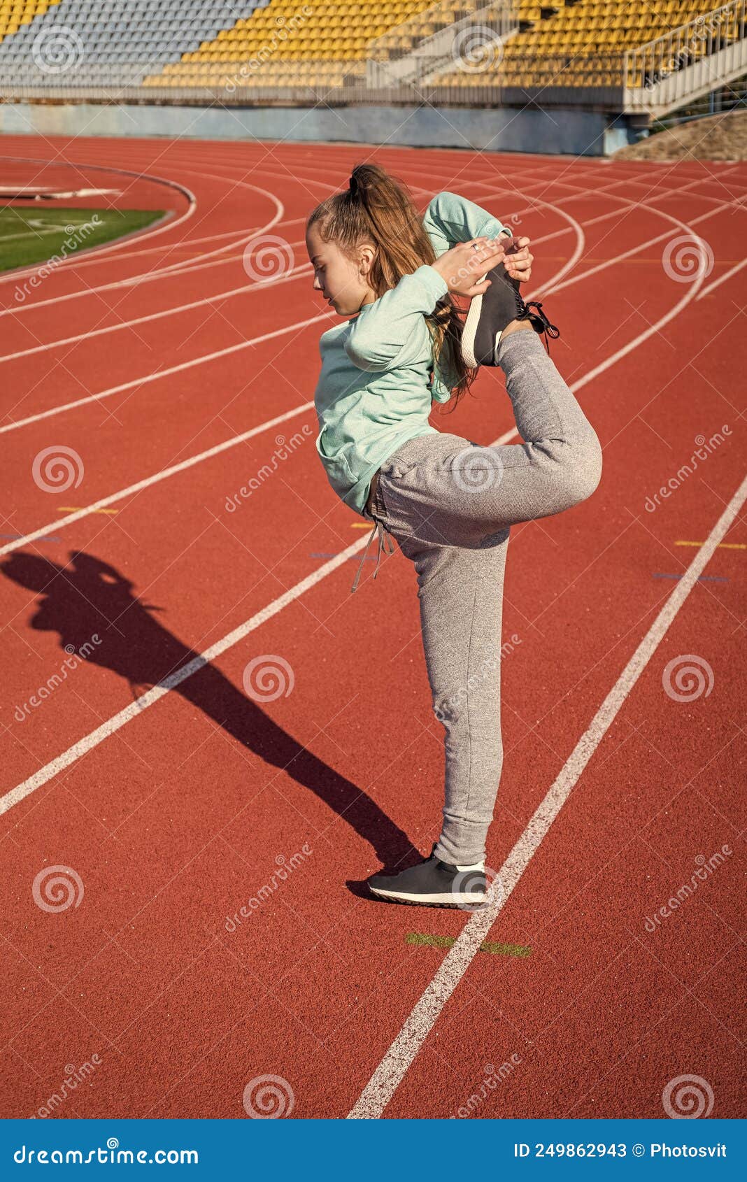 Stretching for Better Flexibility. Flexible Child Hold Foot Standing on ...