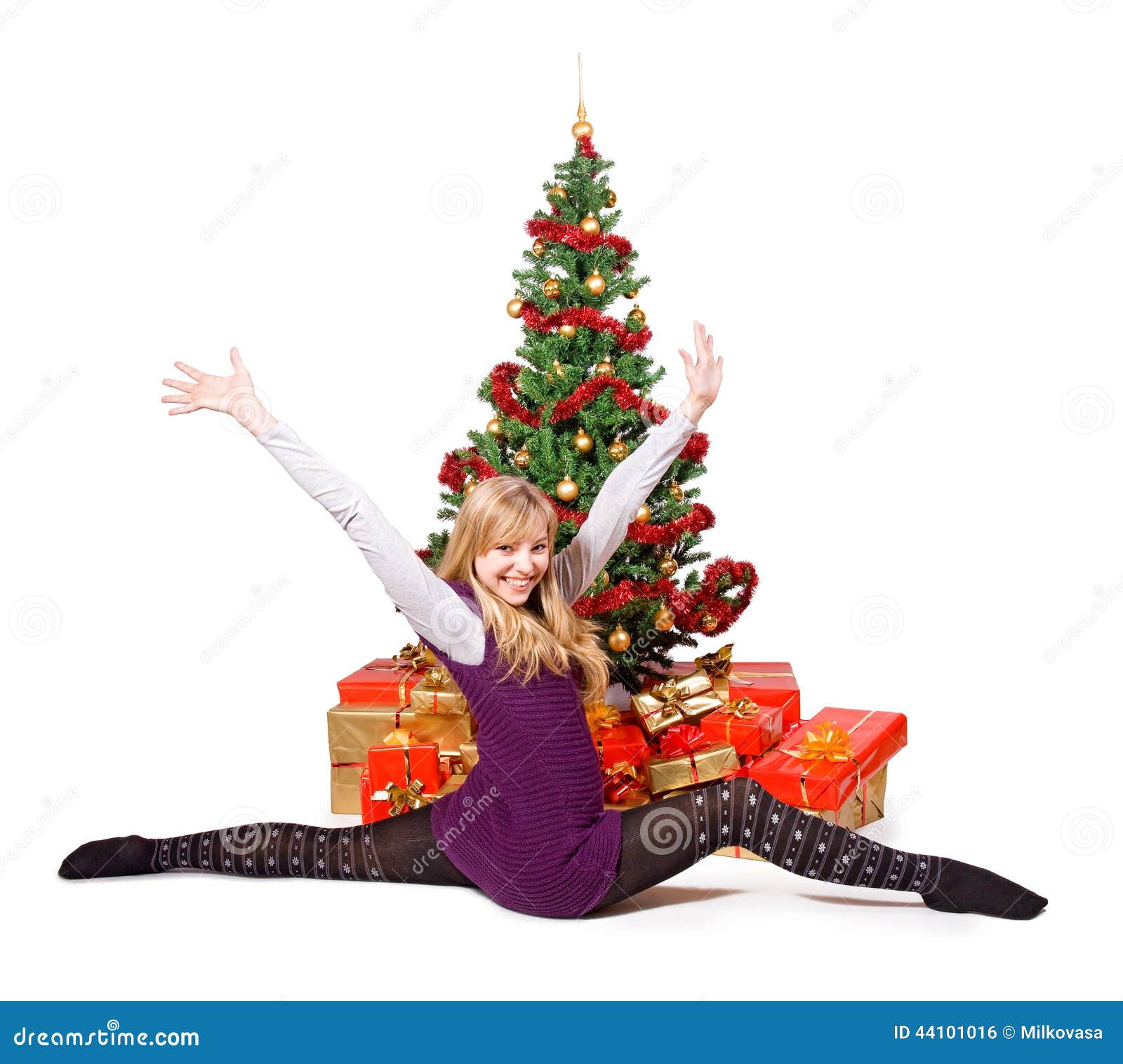 Stretching beside a Christmas Tree Stock Photo - Image of hair, cute ...