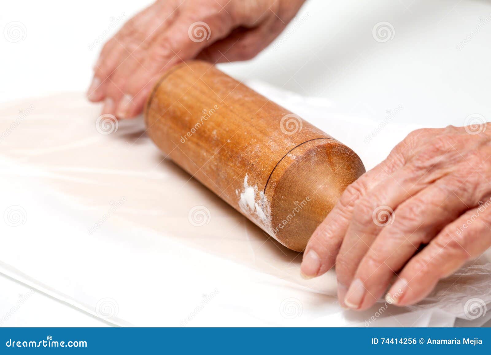 Stretching Dough Using a Plastic Bag and a Rolling Pin Stock Photo ...