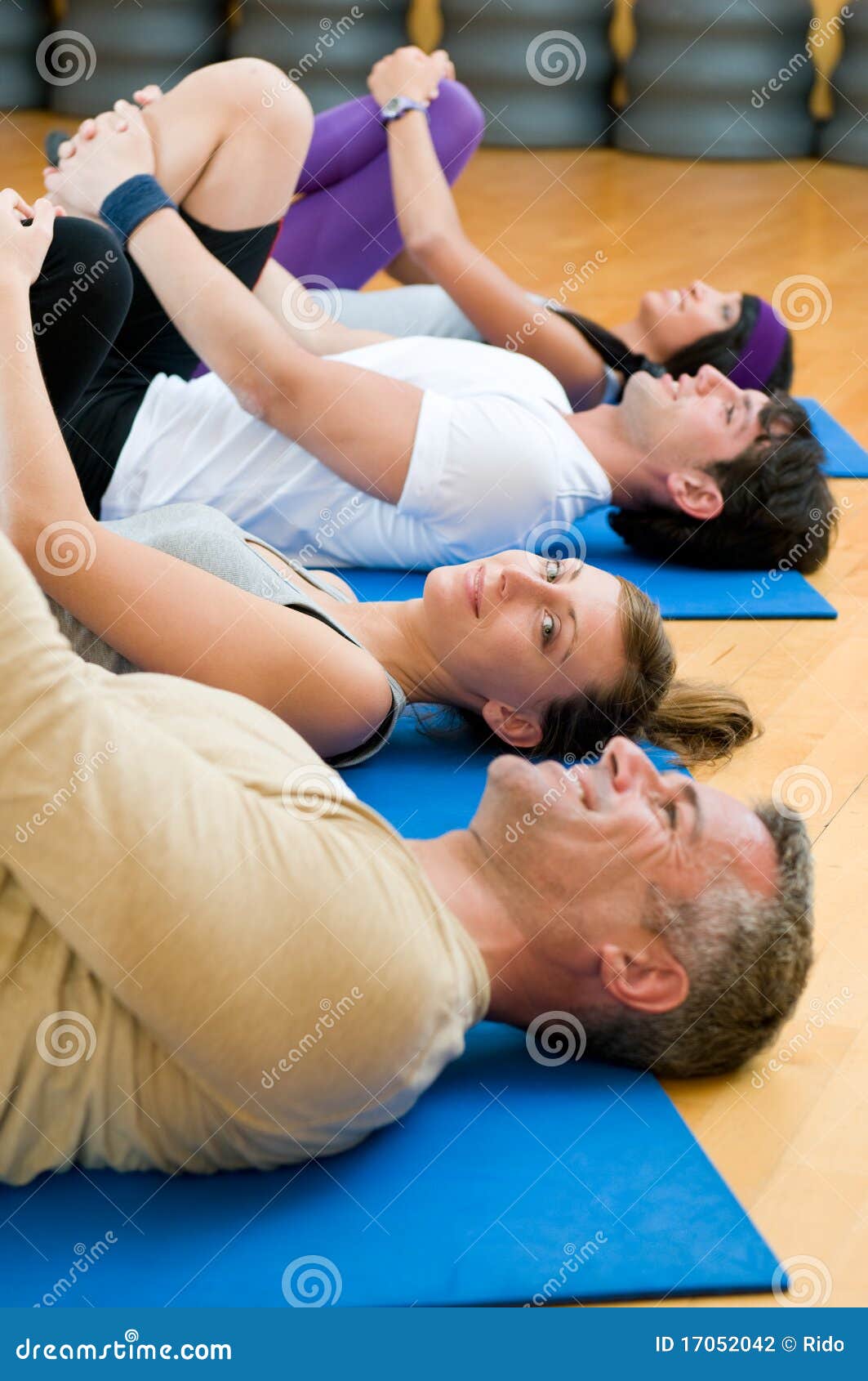 Stretching Exercises at Gym Stock Photo - Image of camera, lying: 17052042
