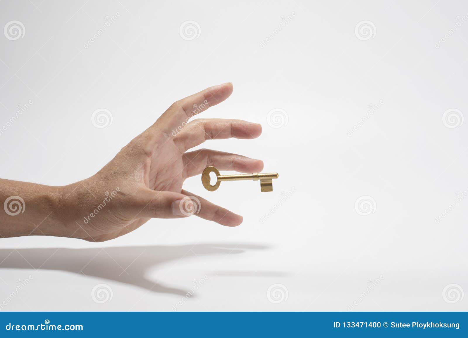 Stretching Hand To Grab the Key Stock Photo - Image of concepts, jigsaw ...
