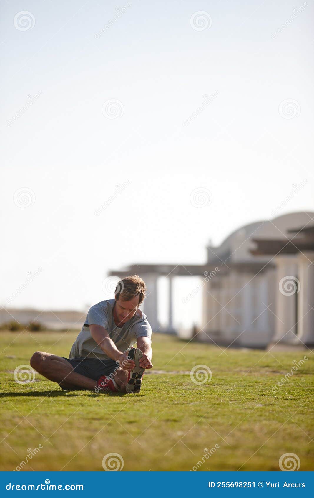 Stretching His Hamstrings. a Man Doing Stretches before His Workout ...