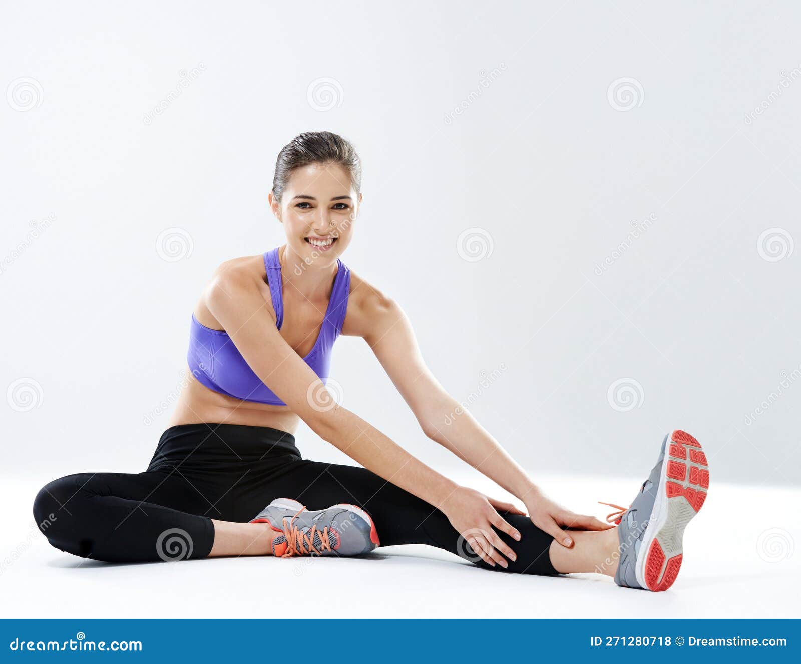 Stretching is Importrant. Studio Shot of a Beautiful Woman Stretching ...