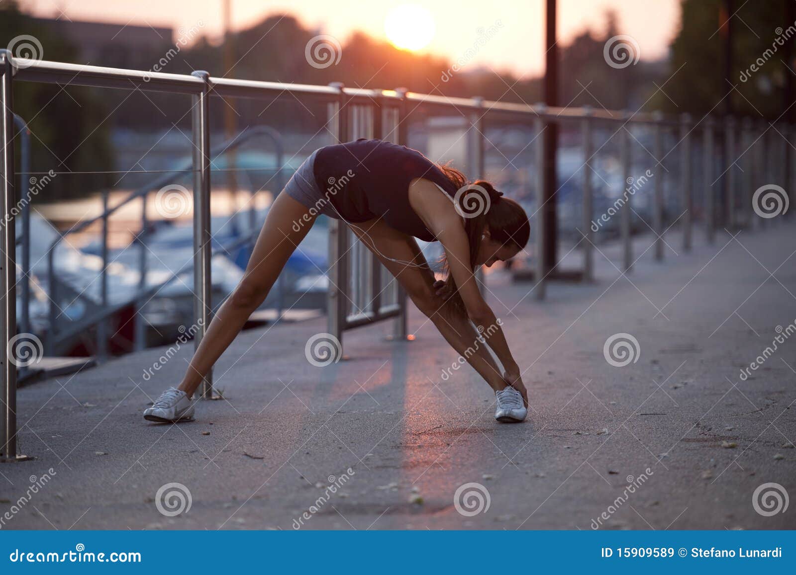 Stretching before jogging stock image. Image of brown - 15909589