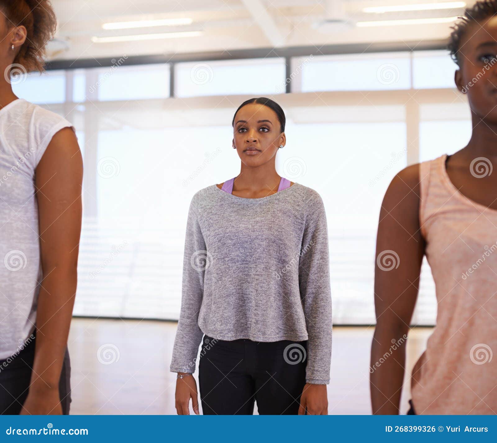 Stretching Keeps Them Focused. a Group of Young Dancers Standing ...