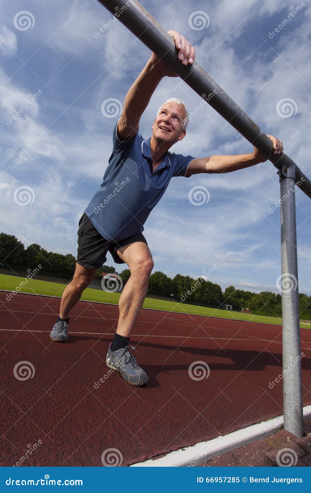 Stretching stock image. Image of ager, athlete, railing - 66957285