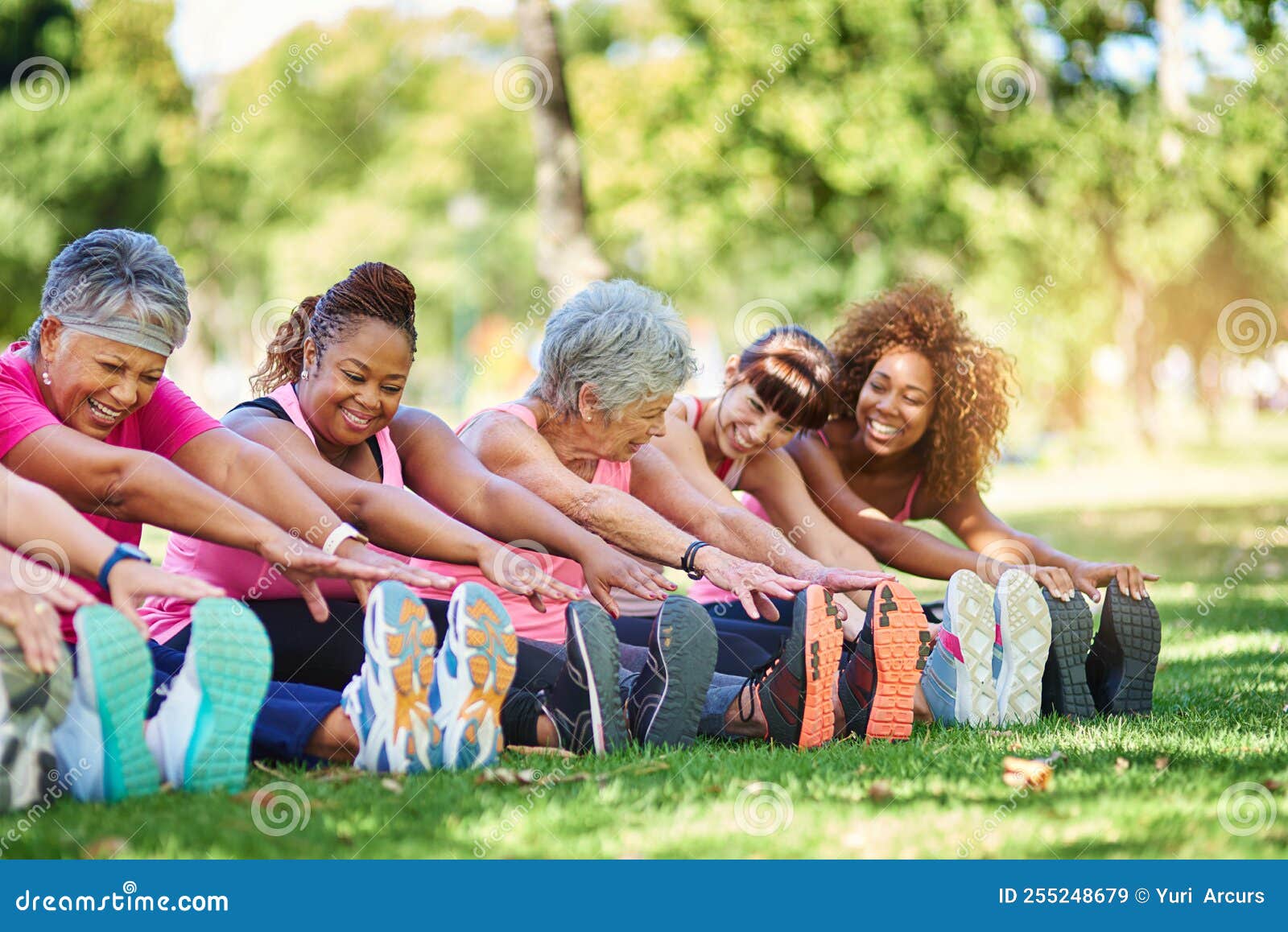 Stretching it Out. a Group of People Warming Up Outdoors. Stock Image ...