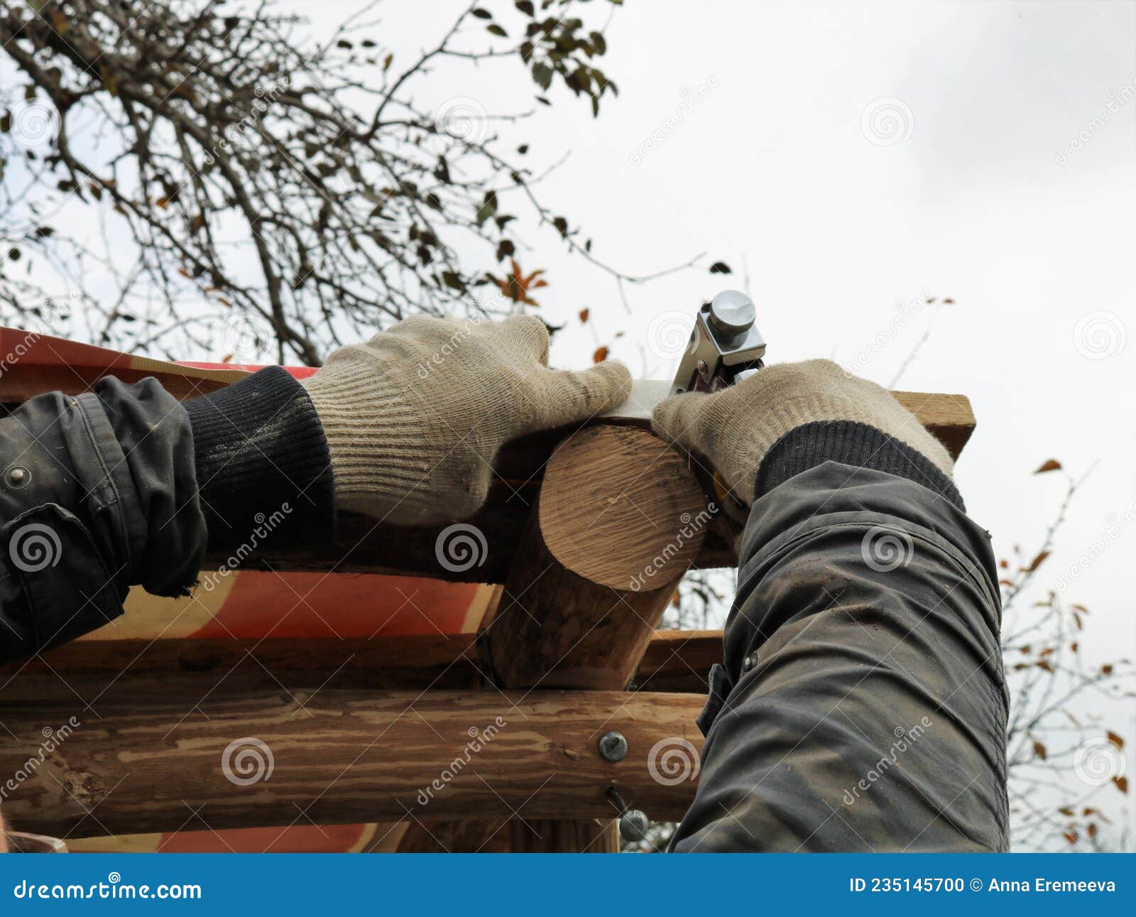 Fastening with Staples Waterproof Material Under the Roof of a Wooden ...