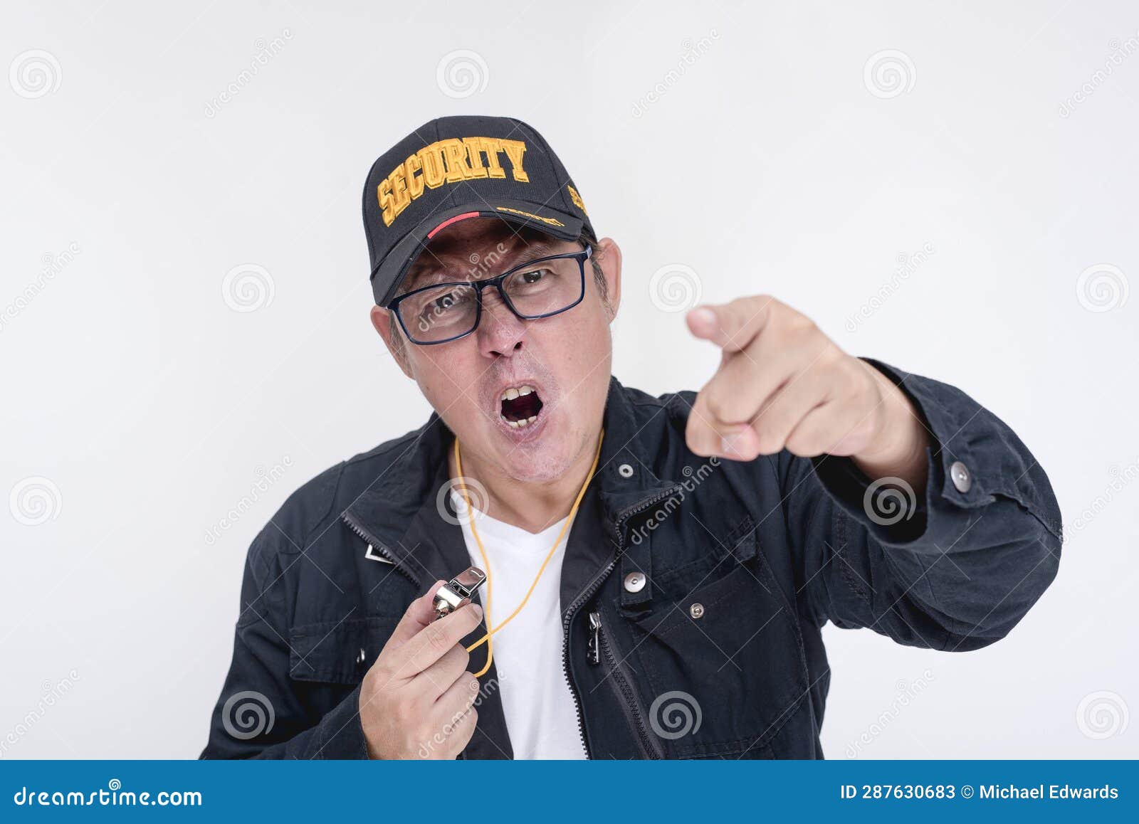 A Strict and Angry Male Security Guard in His 40s Berating Someone ...