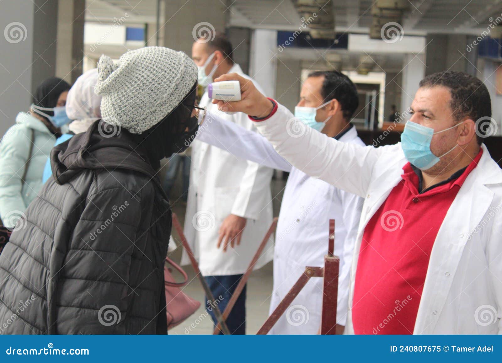 Strict Precautionary Measures before a Building Entry, Temperature ...