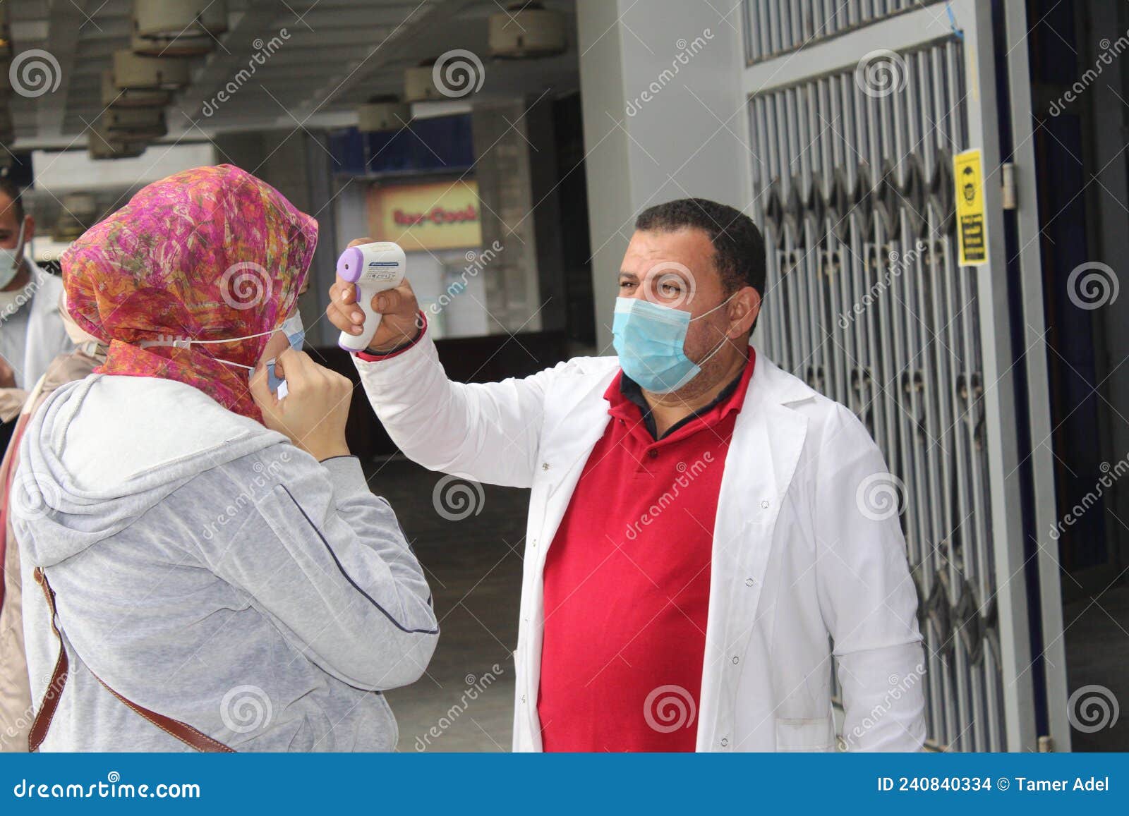 Strict Precautionary Measures before a Building Entry, Temperature ...