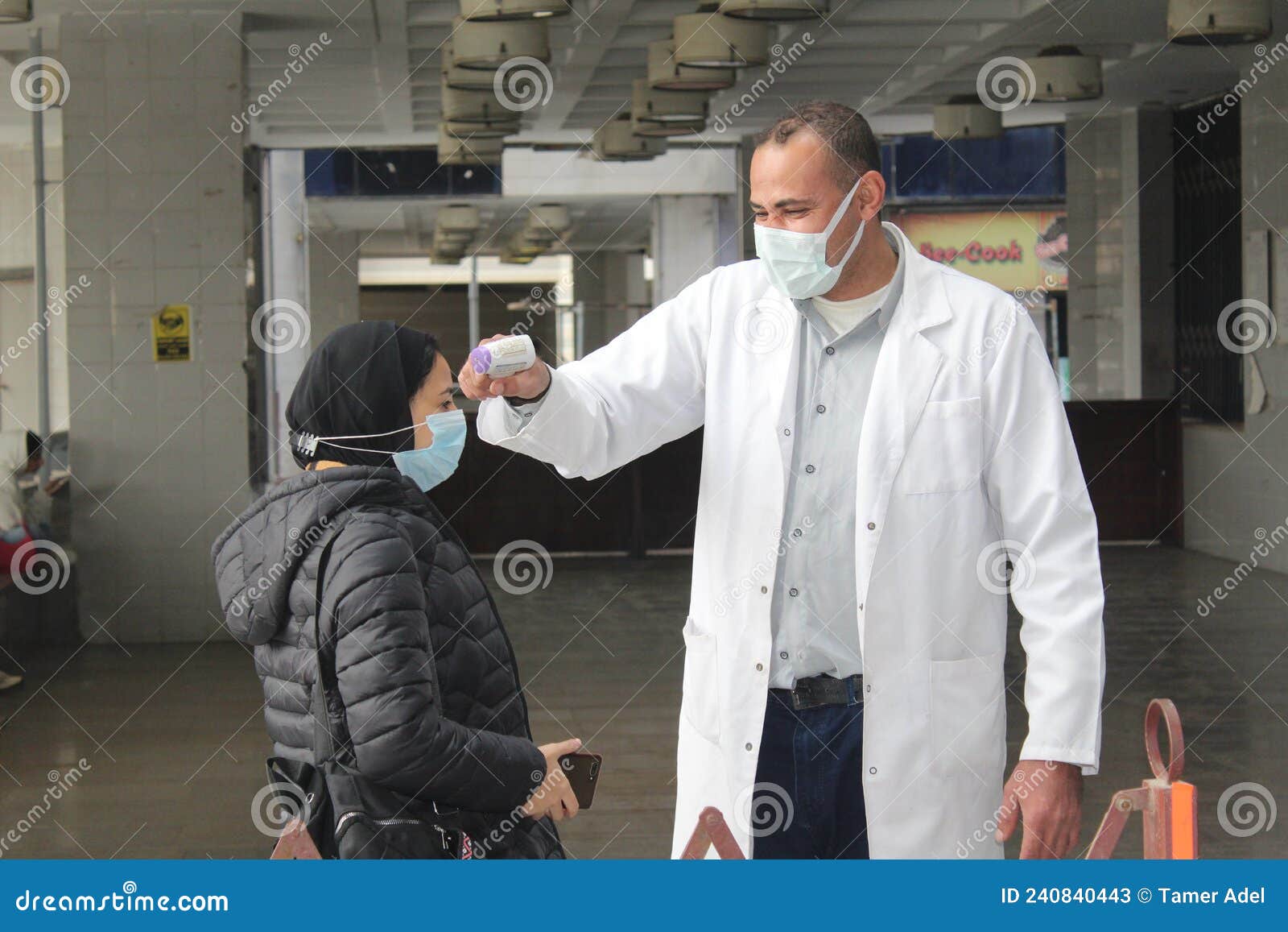 Strict Precautionary Measures before a Building Entry, Temperature ...