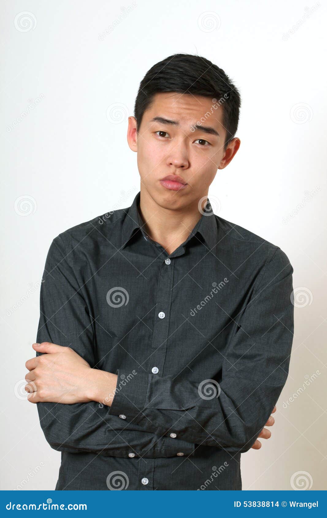 Strict Young Asian Man with Crossed Hands Looking at Camera Stock Photo ...