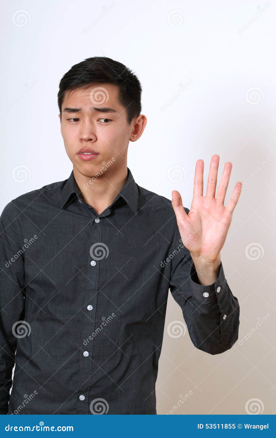 Strict Young Asian Man Giving The Stop Sign Royalty-Free Stock Image ...