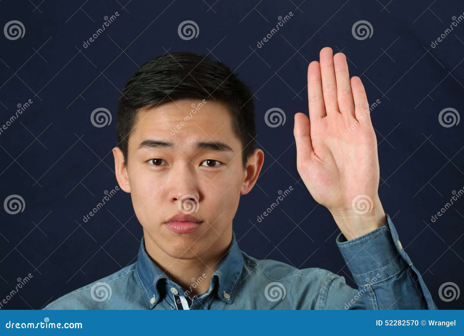 Strict Young Asian Man Giving The Stop Sign Royalty-Free Stock Image ...