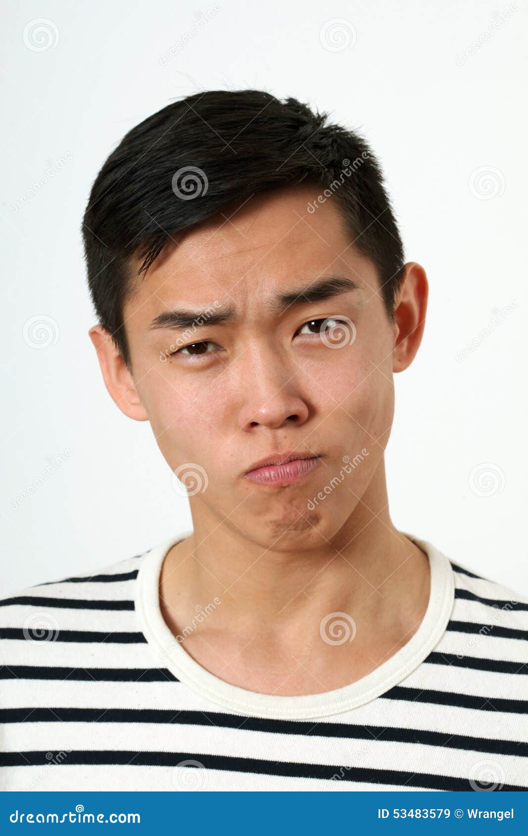 Strict Young Asian Man Making Face and Looking at Camera Stock Image ...