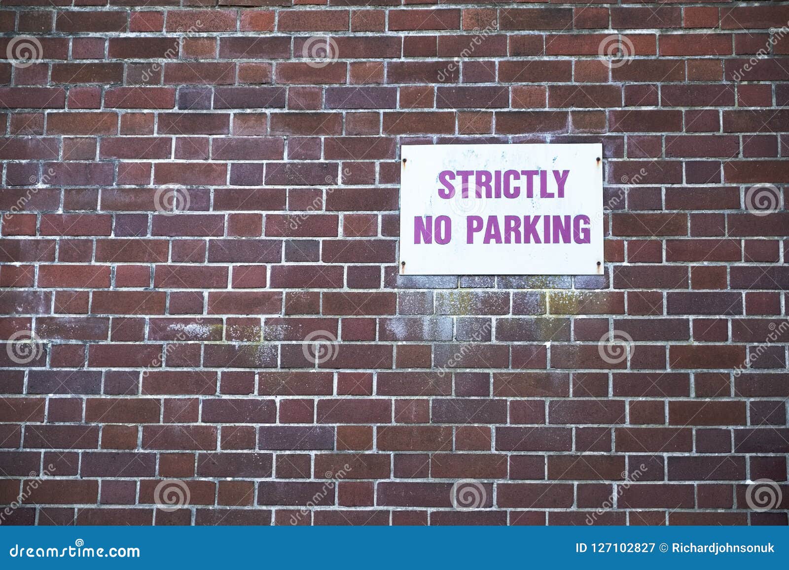Strictly No Parking Sign On Brick Wall Background Royalty-Free Stock ...
