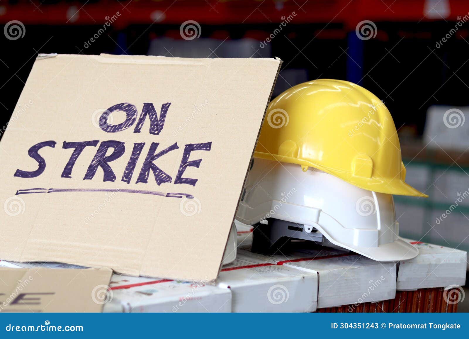 On Strike Banner Placard with Two White and Yellow Worker Helmets at ...