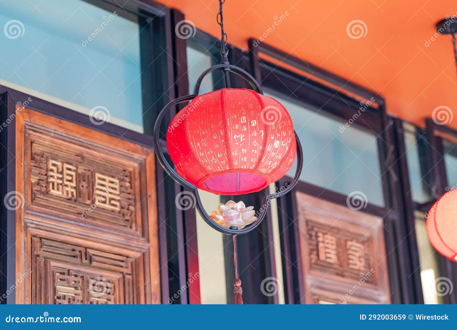 Striking Red Lantern Suspended on the Side of a Structure Stock Image ...