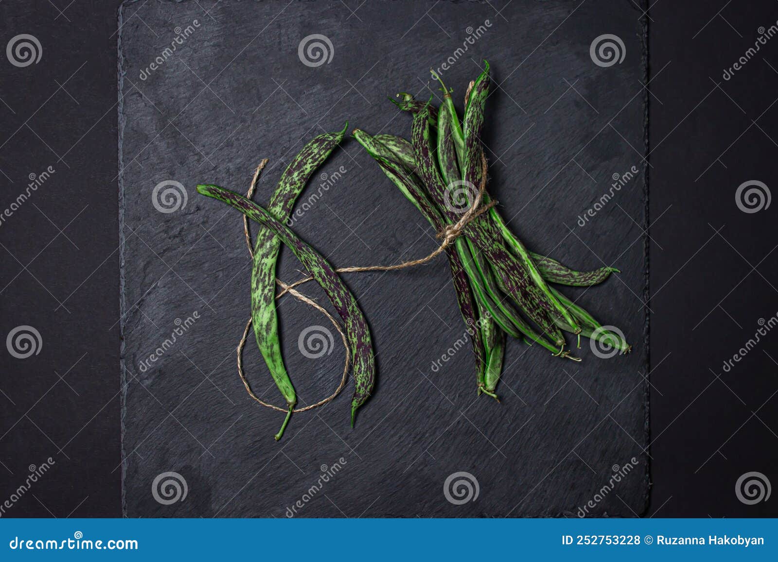 String Beans on a Black Background. a Bunch of Raw Green Beans Tied ...