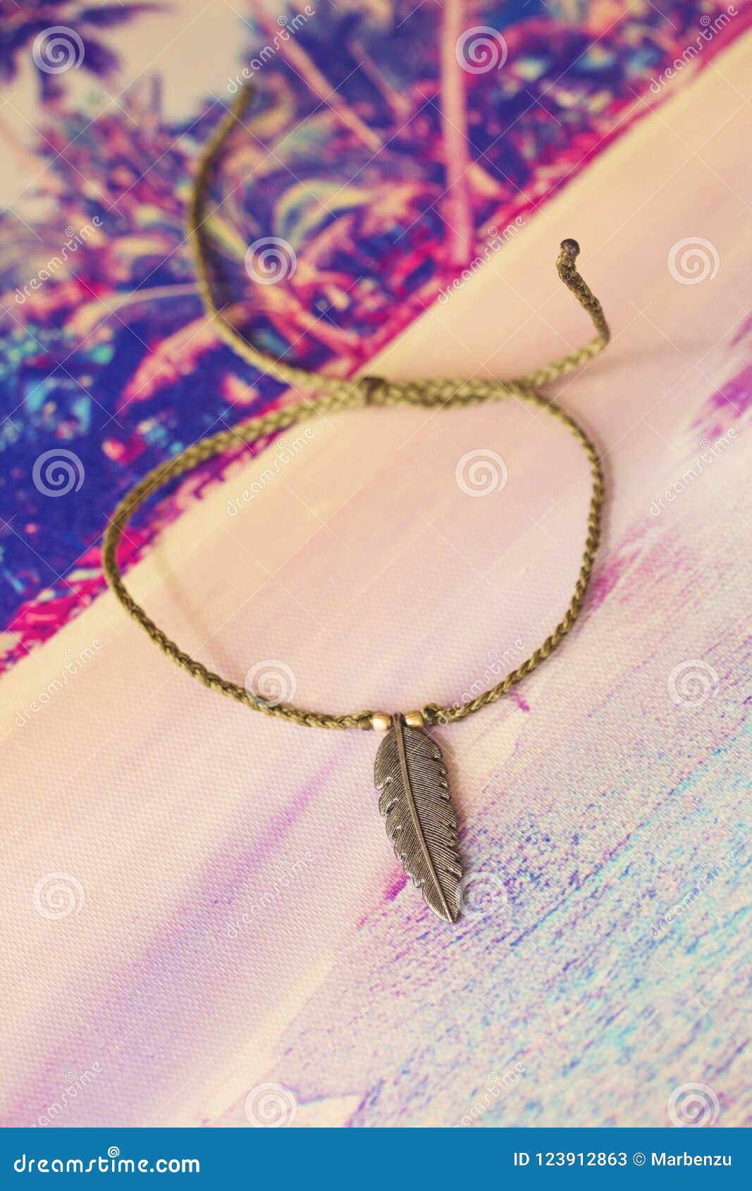 String Bracelet with Metal Feather Pendant Stock Image - Image of ...