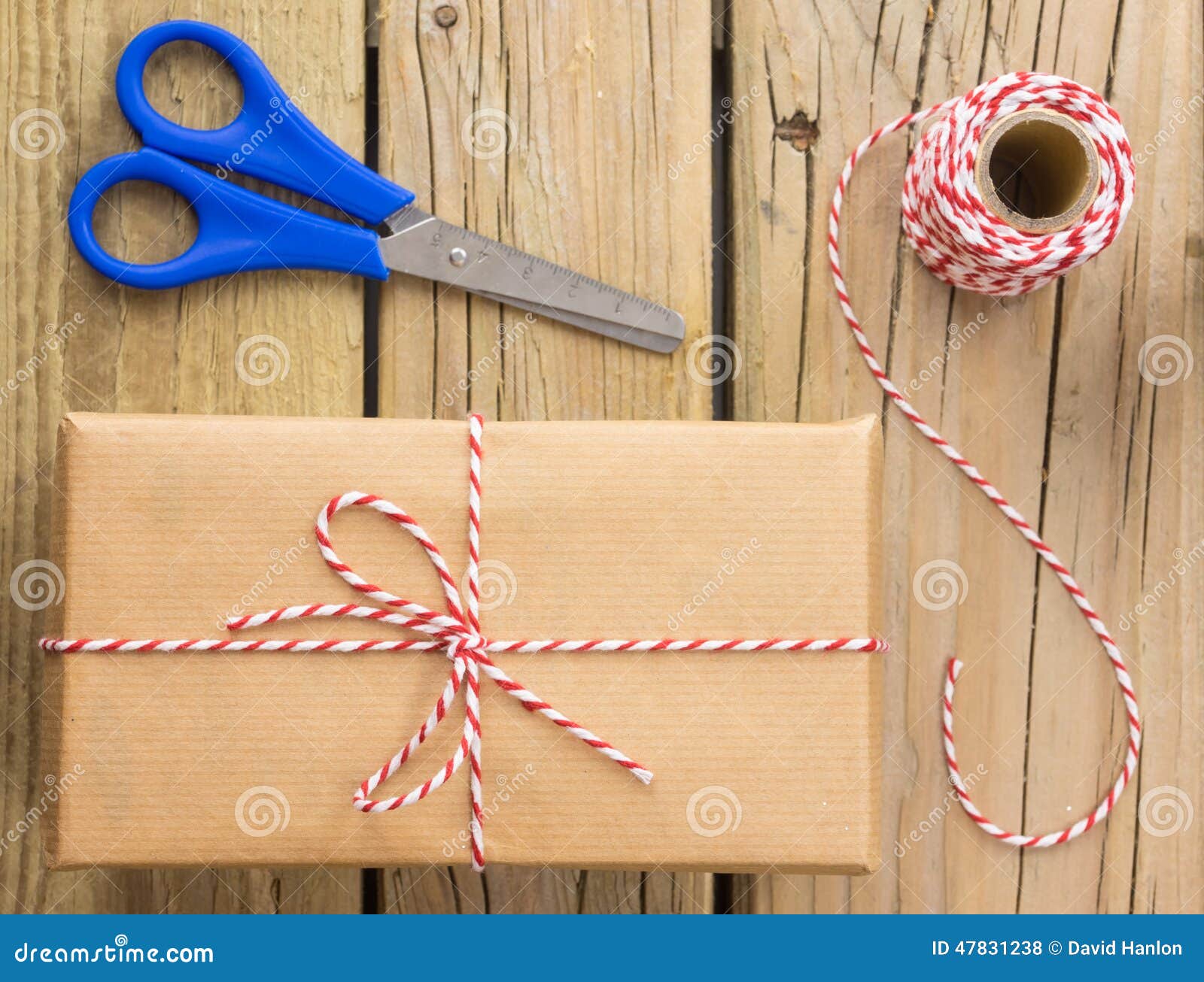 String and Brown Paper Parcel with Scissors and String Stock Photo ...