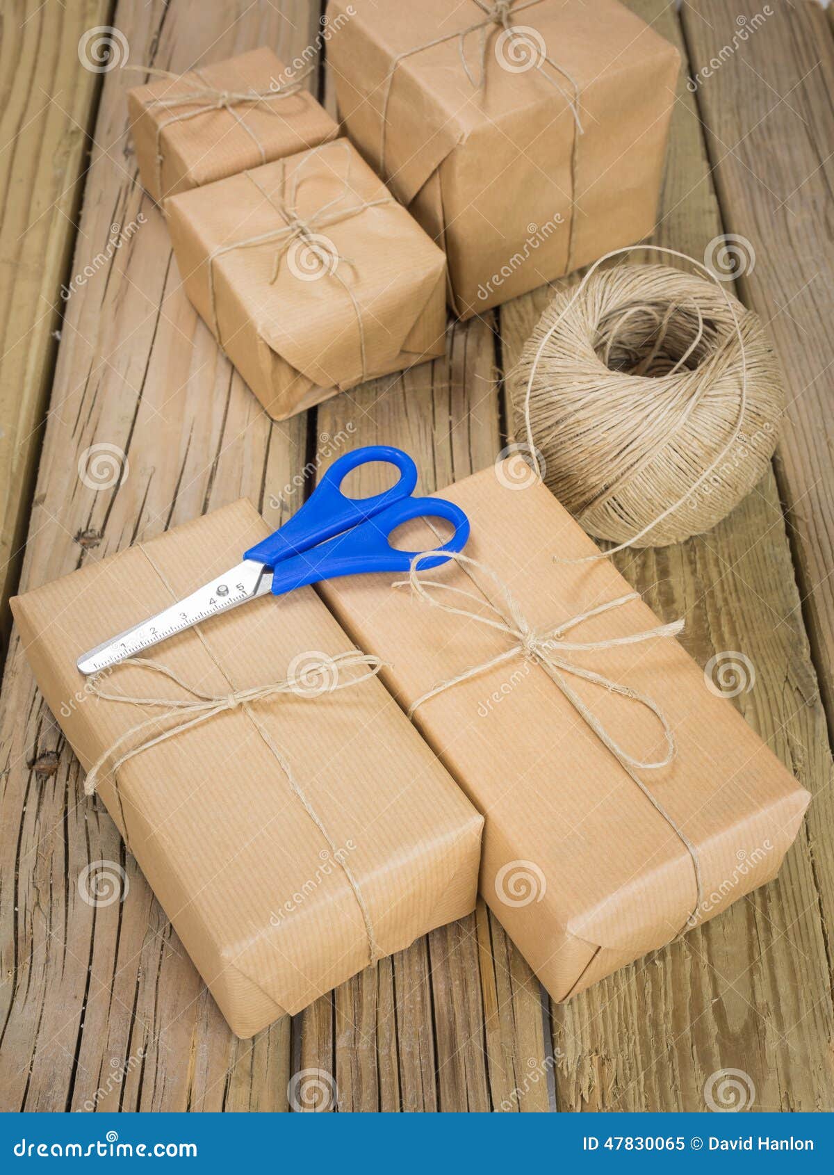 String and Brown Paper Parcels with Scissors and String Stock Image ...