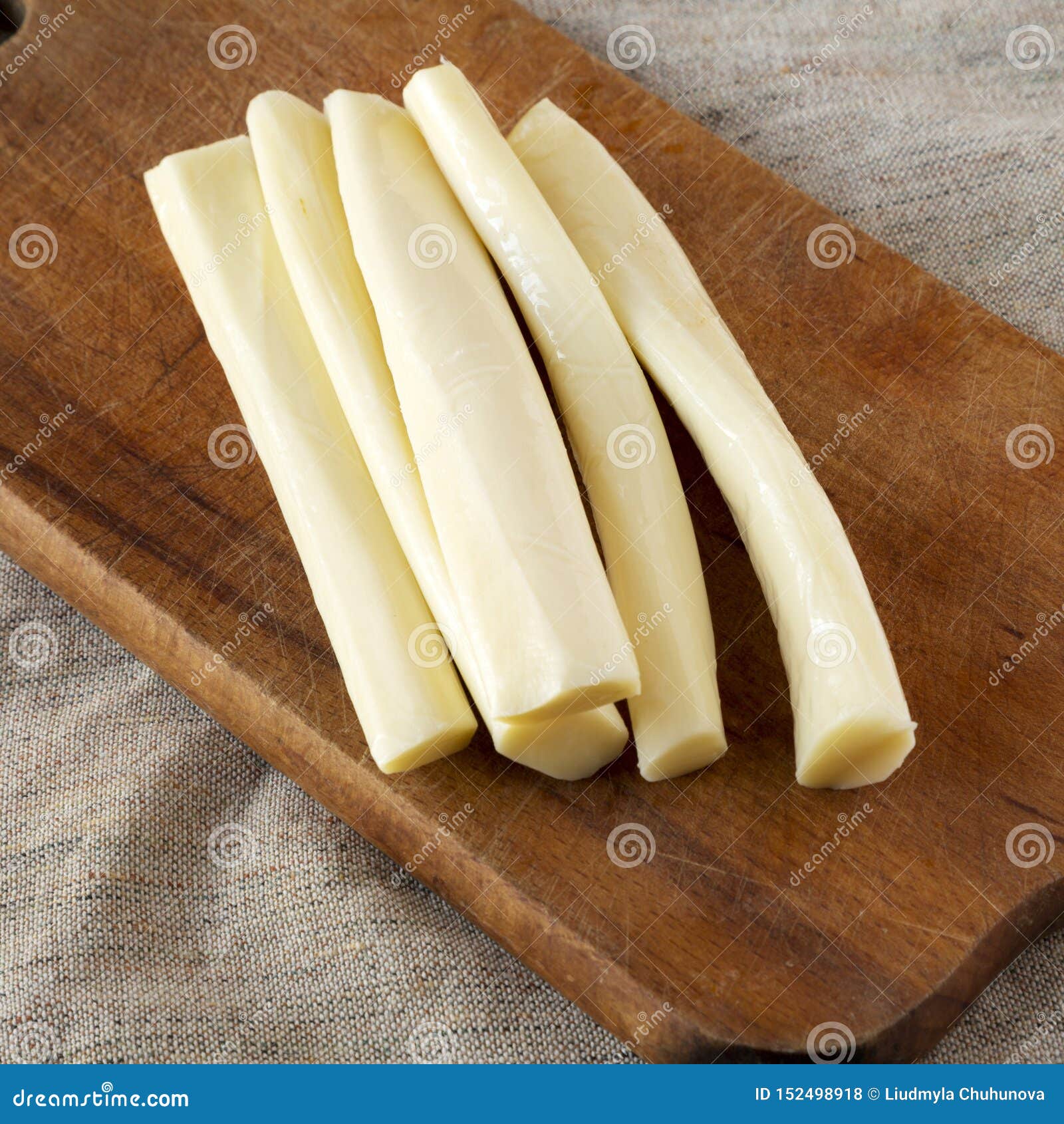 String Cheese on a Rustic Wooden Board, Low Angle View. Healthy Snack ...
