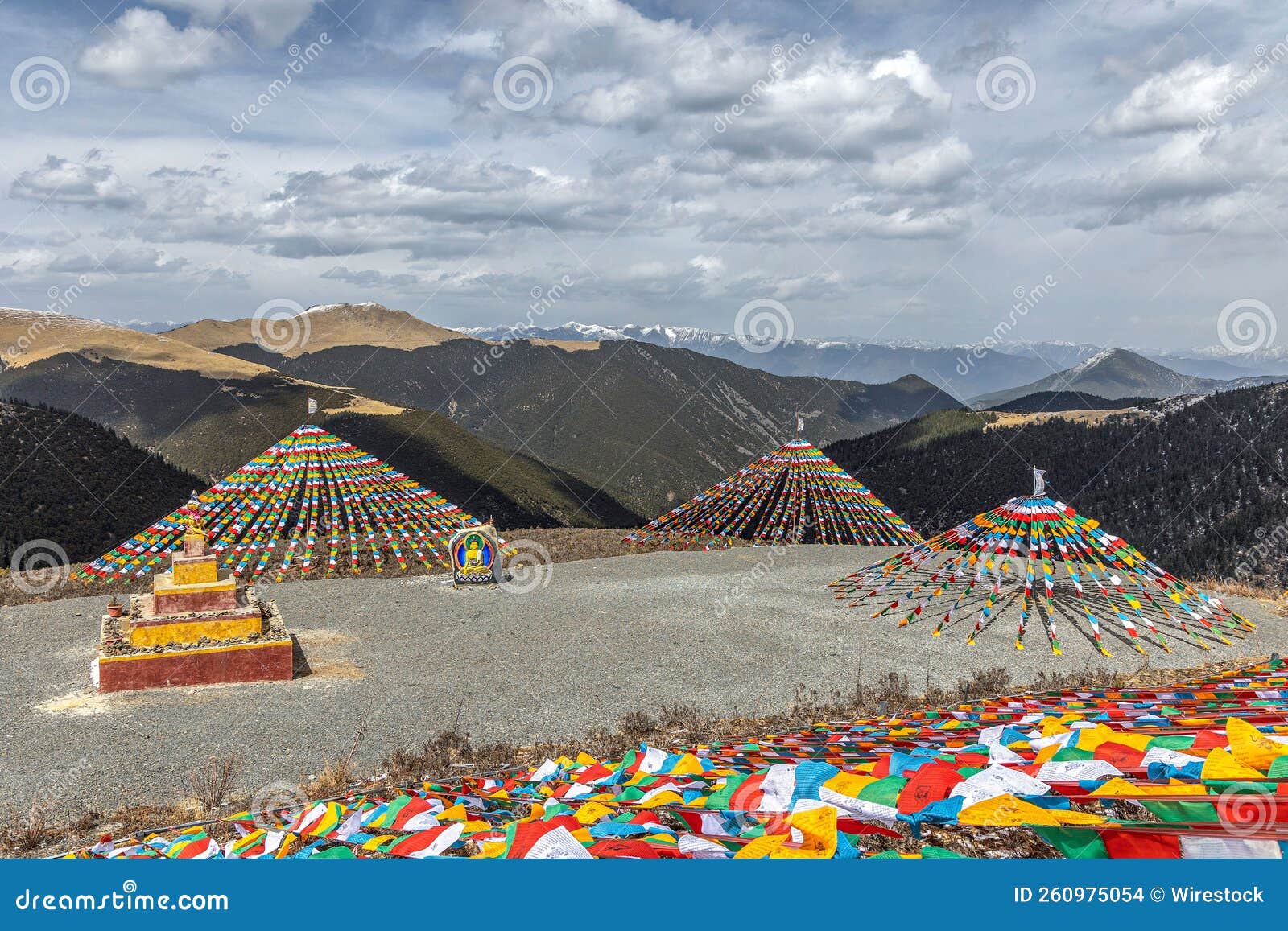 String of Colorful Tibetan Prayer Flags in Pyramid Form Surrounded by ...