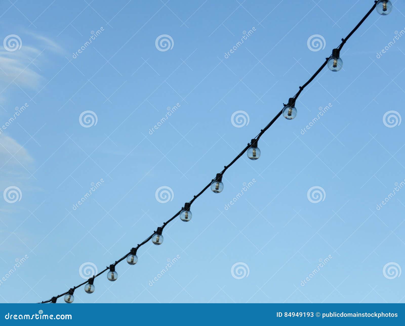 String Of Lights With Blue Sky In Background Picture. Image: 84949193