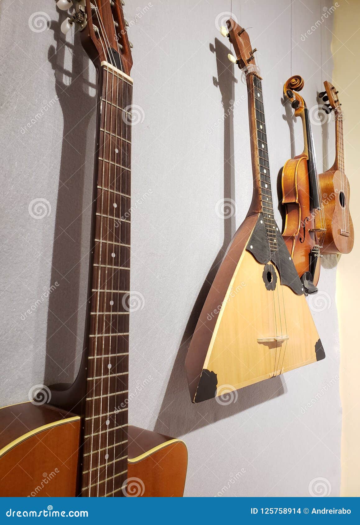 String Musical Instruments on a Wall Stock Photo - Image of instruments ...