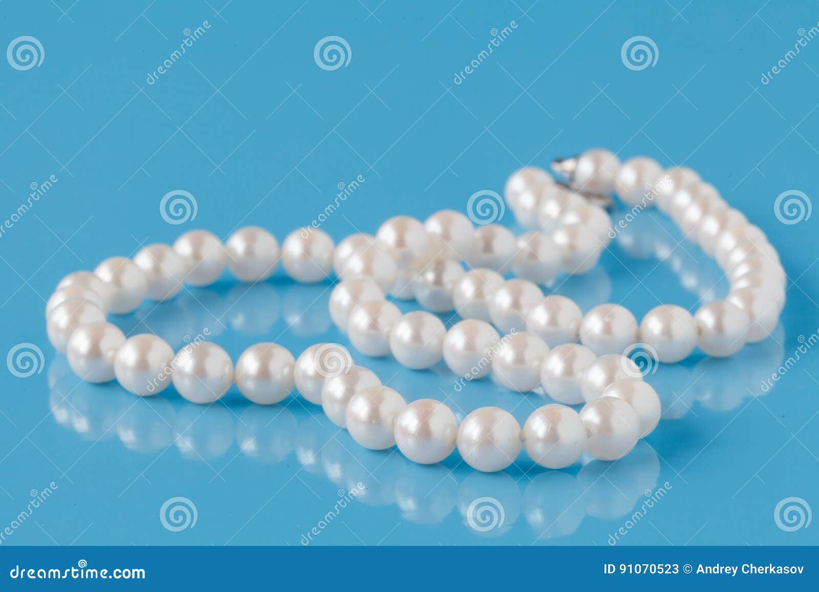 String of Pearls on a Blue Background Stock Image - Image of jewelry ...
