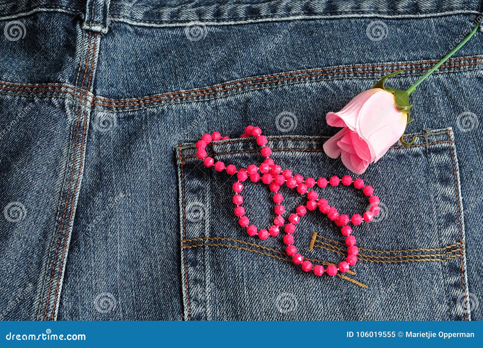 A String of Pink Beads and a Pink Artificial Rose Stock Image - Image ...