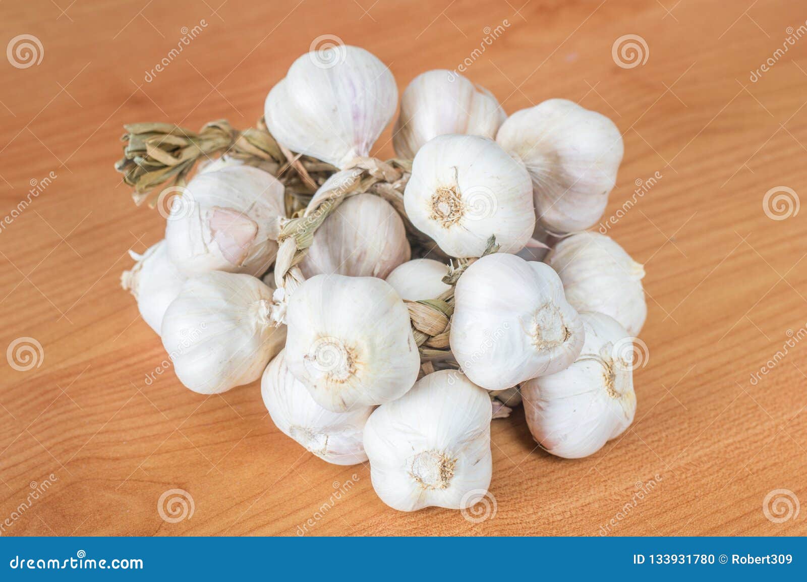 String of Polish Garlic Bulbs at Wooden Table Stock Photo - Image of ...