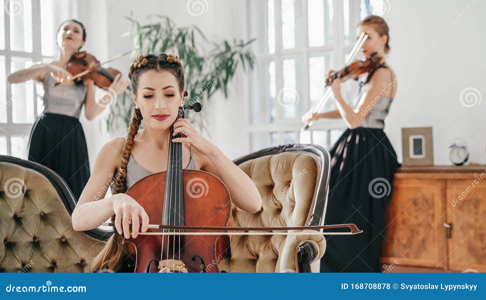 The String Quartet Performs in a Large Room with Big Windows Stock ...