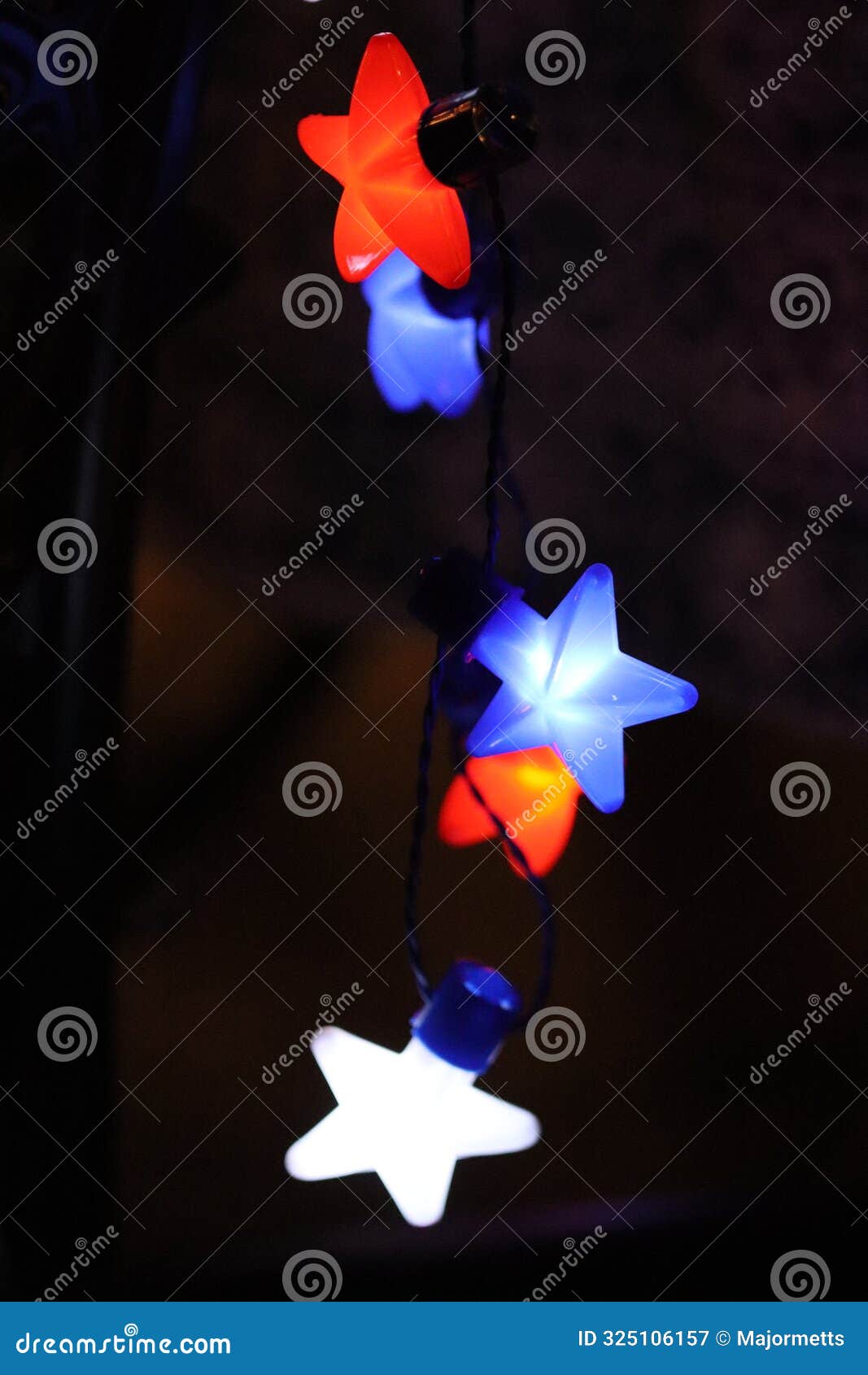 String of Red, White, and Blue Star Lights at Night Stock Image - Image ...